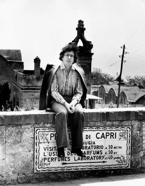 ITALIAN SINGER PEPPINO di Capri posing sitting on a step of stone- 1970 ...