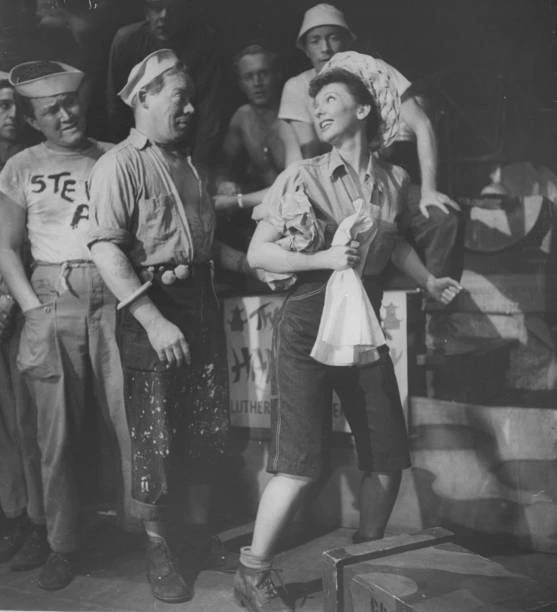ACTRESS MARY MARTIN in straw hat singing w Actor Myron McCorma- 1940s ...