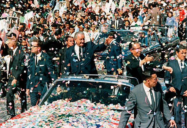 PRESIDENT LYNDON B Johnson waves to crowd during ticker-tape parade Old ...