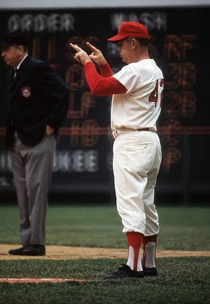 WASHINGTON SENATORS FIRST base coach Nellie Fox relaying sign duri- Old ...
