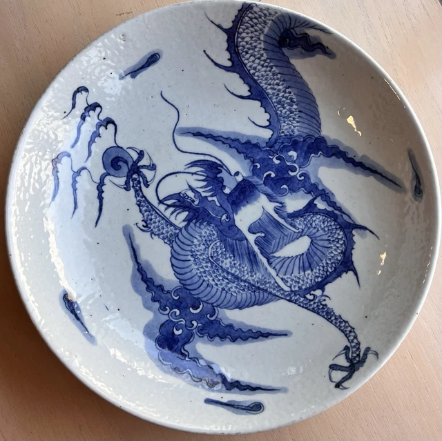 CHINESE ANTIQUE BLUE and white dragon pattern plate over the wall £215. ...
