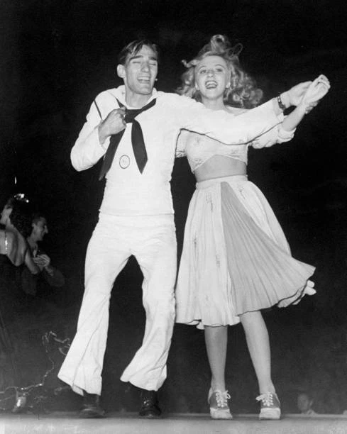 FRANK PIRO AND Ann Milne dance with joy after winning the 1942 Har ...