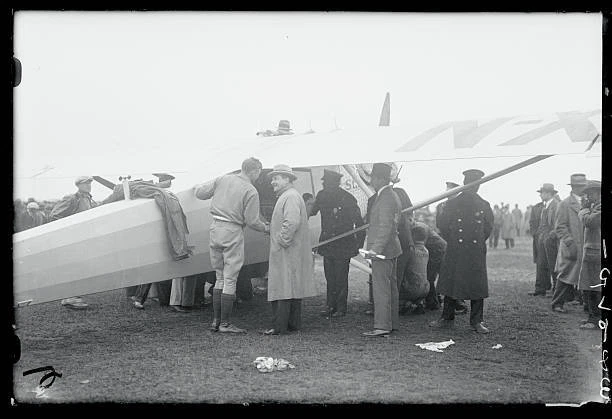 CHARLES LINDBERGH IS shown wit B J Mahoney loading his plane be- 1927 ...