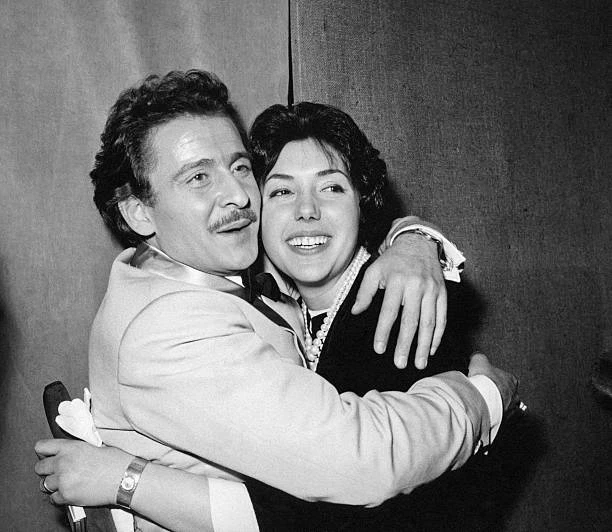 ITALIAN SINGER SONGWRITER actor Domenico Modugno hugging wife Ital- Old ...