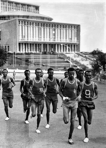 ABEBE BIKILA LEADS The Ethiopian Imperial Guard Athletic Team O 1964 ...