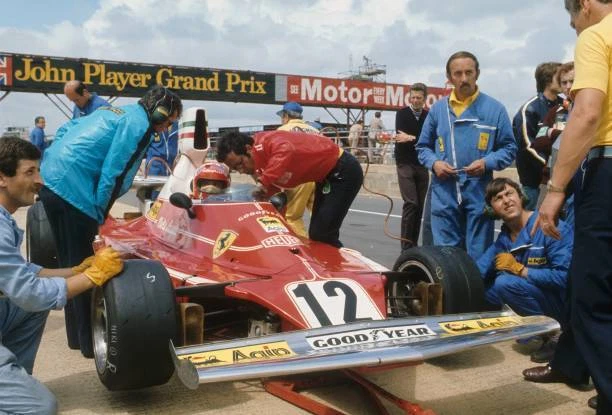 BRITISH GRAND PRIX, View of Niki Lauda in car surrounded by crew m ...