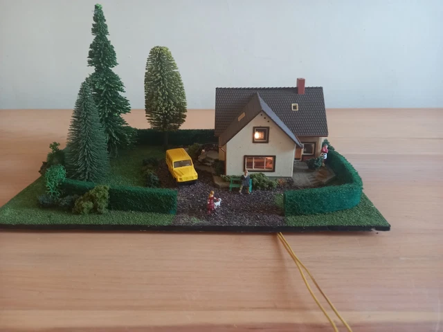 RAILWAY DIORAMA 00 gauge. House with light and garden with people and ...