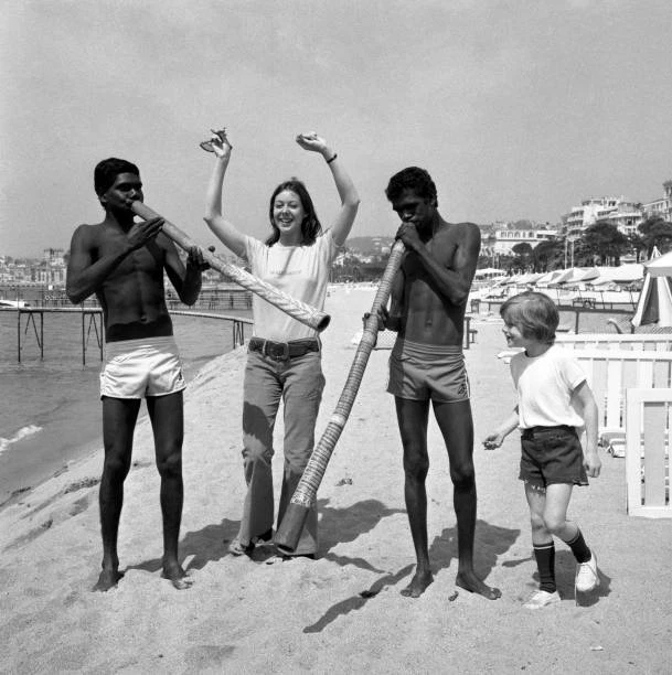 BRITISH ACTRESS JENNY Agutter with two aborigines at the Cannes Fi- Old ...