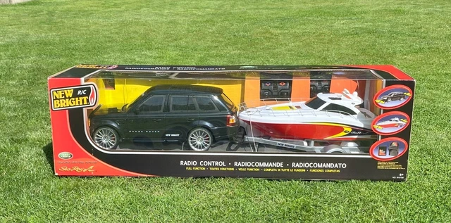 NEW BRIGHT RADIO Controlled RC Land Rover with Boat on trailer £30.00 ...