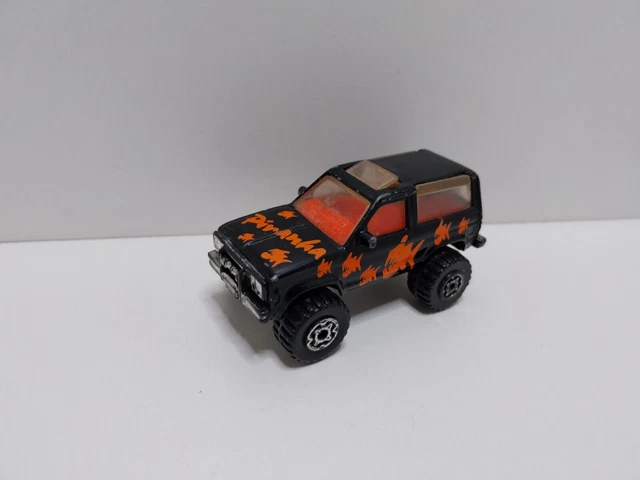 MATCHBOX 4X4 FORD Bronco II pickup 1987 Piranha modèle réduit voiture ...