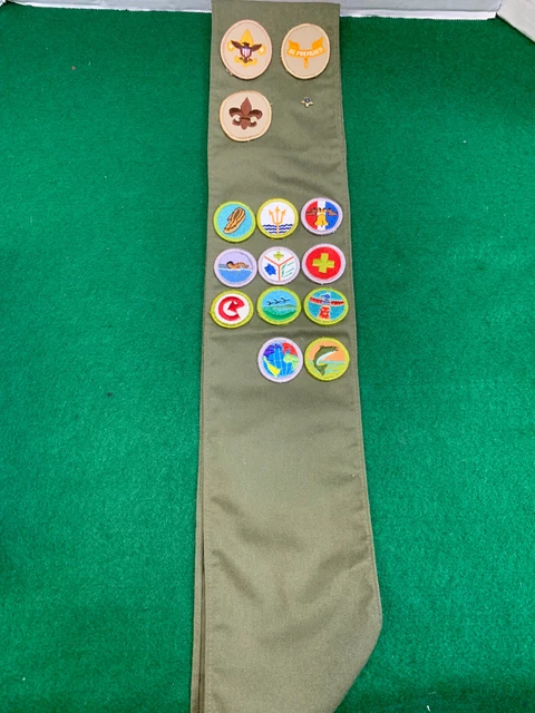 11 BOY SCOUT merit badges and sash. Rank patches and 4 years service ...
