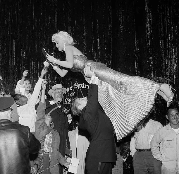 ACTRESS JAYNE MANSFIELD is lifted by Mickey Hargitay as she signs ...