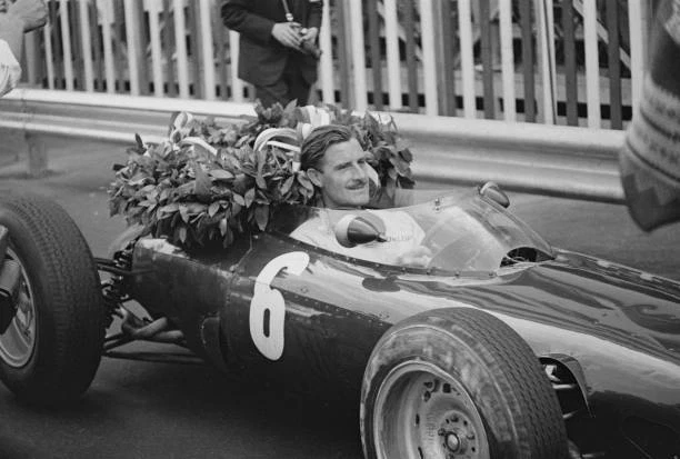 ENGLISH RACING DRIVER Graham Hill pictured in the driver's seat of ...
