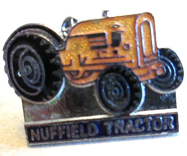 NUFFIELD TRACTOR - Vintage Tractor on Enamel and Metal Badge (19) £12. ...