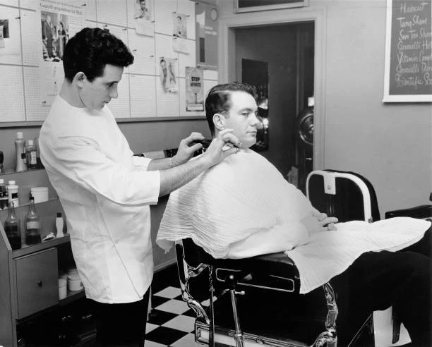 AMERICAN ACTOR CLIFF Robertson Gets A Haircut At The Barbers Circa Old ...