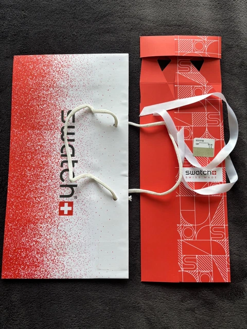 SWATCH PACKAGING - Carrier bag with white cord handles & packaging with ...