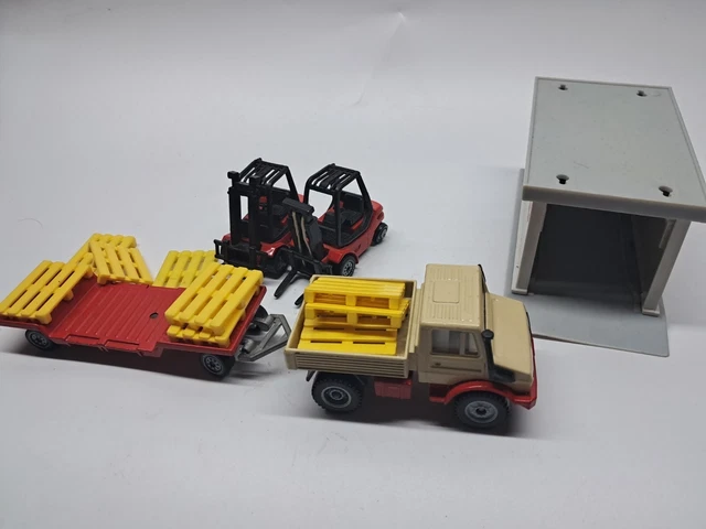 SIKU 2522 UNIMOG U 1500 (Mercedes) mit Gabelstapler 1:55 - 1554 EUR 25 ...
