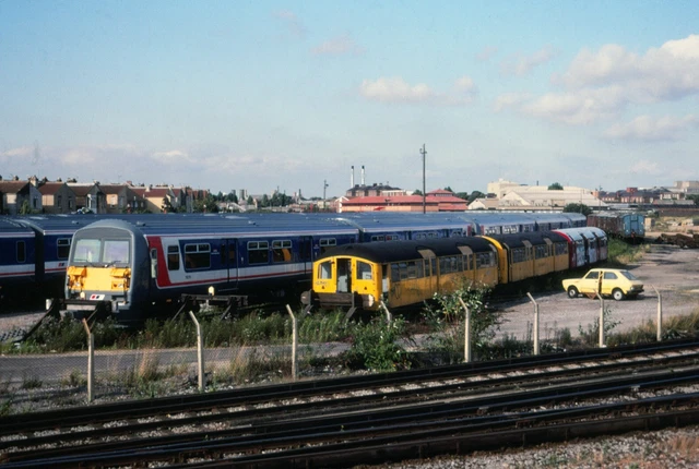 6801 EMU CLASS 456 021 AT FRATTON ALONGSIDE Ex IOW TUBE STOCK 1991 £3. ...