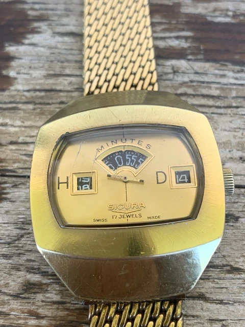 MONTRE À GUICHET, jump hour, heure sautante, Sicura. , mécanique EUR 70 ...