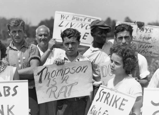 PICKET LINE STRIKERS holding handwritten placards, among them 'Tho Old ...