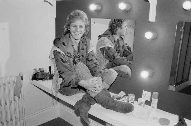 ENGLISH ACTOR AND singer Paul Nicholas in a backstage dressing room ...