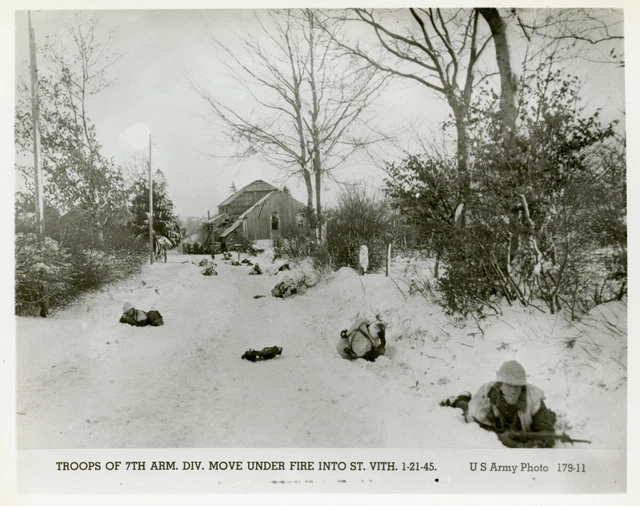 7TH ARMORED DIVISION taking cover as they enter Saint-Vith Belgium 1945 ...