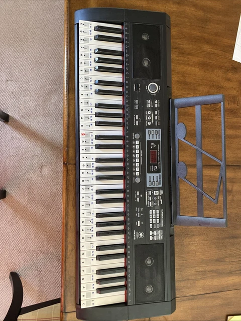 ELECTRIC KEYBOARD- 61 Key Full Size table top, attached music stand ...