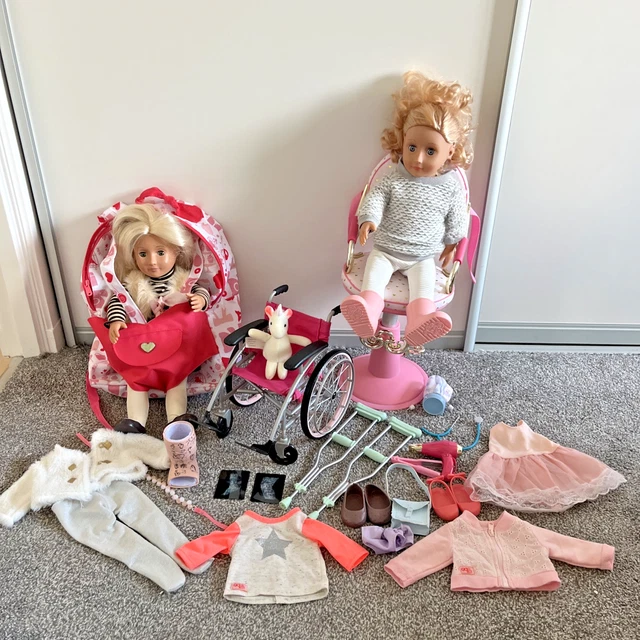 OUR GENERATION BUNDLE - 2 dolls, chair, wheelchair, bag, crutches cast ...