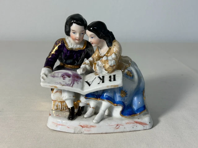 BEAUTIFUL PORCELAIN FIGURINES pair sitting with fine painting, 18th ...