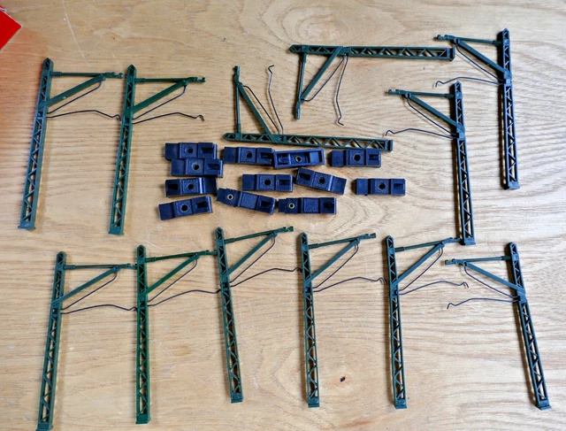 TRI-ANG RAILWAYS BOX of 12 single track catenary masts- All look to be ...