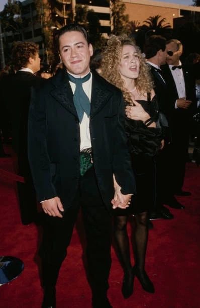 ROBERT DOWNEY JR wearing a black suit a white shirt teal tie partn- Old ...