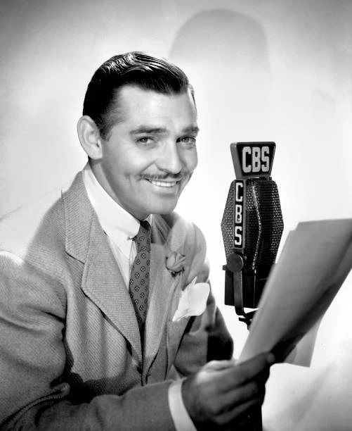 HOLLYWOOD ACTOR CLARK Gable at Radio microphone He performs as J 1940s ...