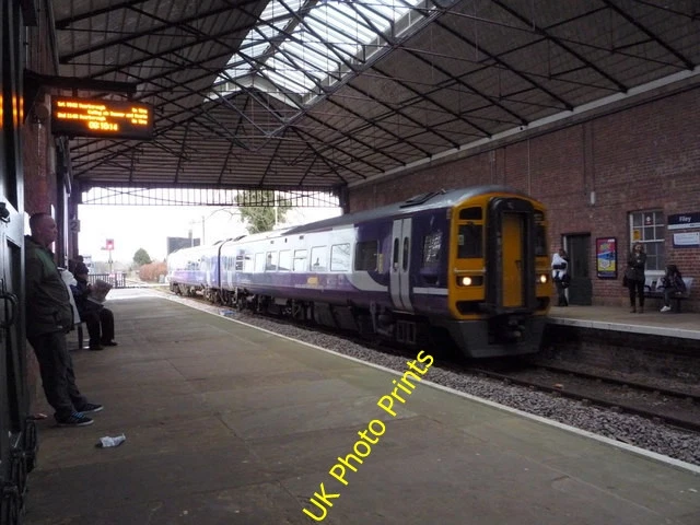 PHOTO 6X4 FILEY Railway Station Northern Rail train arriving at ...