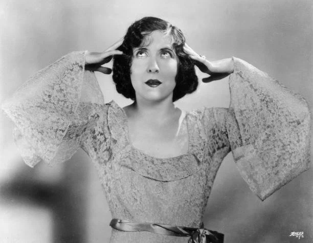 PORTRAIT OF AMERICAN comedian and actor Gracie Allen holding he- 1937 ...