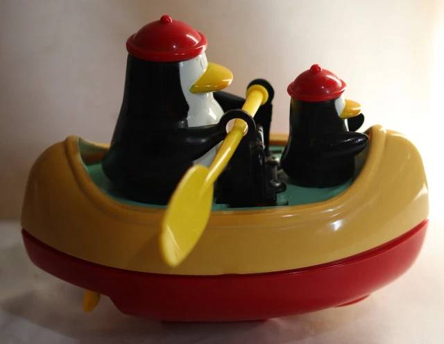 RARE VINTAGE MASUDAYA Penguin Paddling Canoe Plastic Clockwork Toy £50. ...