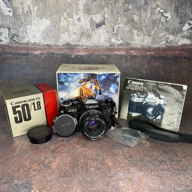 APPAREIL PHOTO ARGENTIQUE Canon Olympic Edition noir AE- 1 35 mm en boîte + FD 50 mm F1,8 - LIRE ...