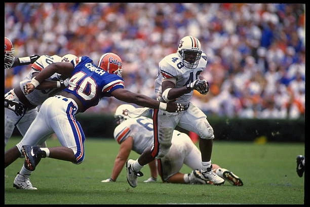 RUNNING BACK STEPHEN Davis of Auburn University carries the foo- 1995 ...
