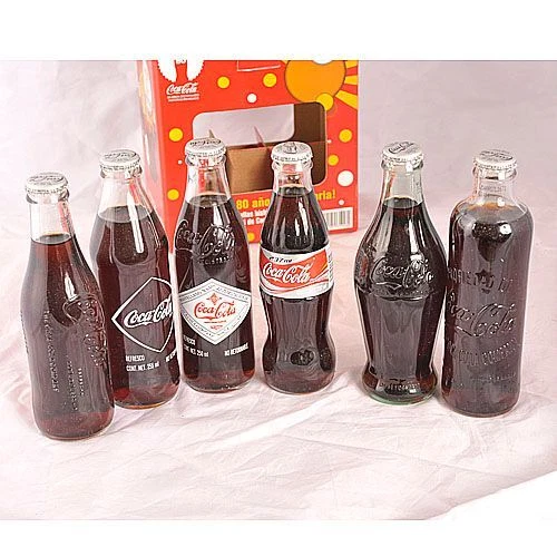 COCA COLA 80 years of history, 6 bottle set collectible six pack £160. ...
