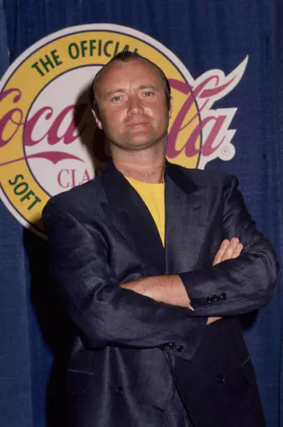 SINGER SONGWRITER DRUMMER actor Phil Collins wearing a blue suit j- Old ...