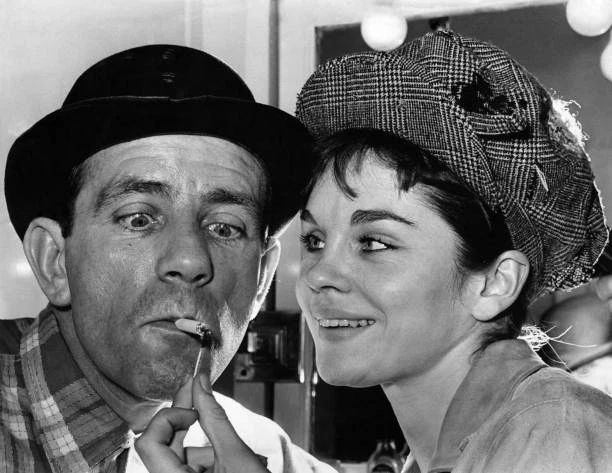 NORMAN WISDOM GETS a light from co-star Sally Smith 1964 Old Photo EUR ...