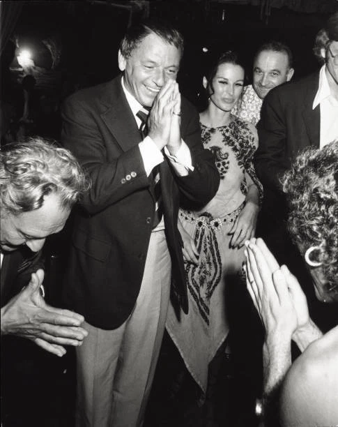 ITALIAN AMERICAN SINGER and actor Frank Sinatra dancing in restaur ...