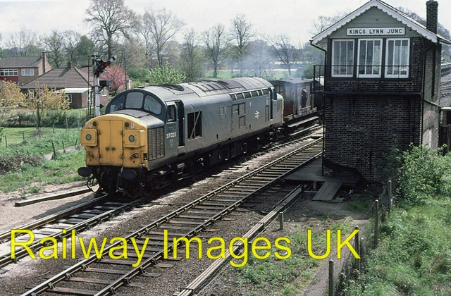 RAILWAY PHOTO - 37023 brings a train of BIS sand Hoppers into Kings ...