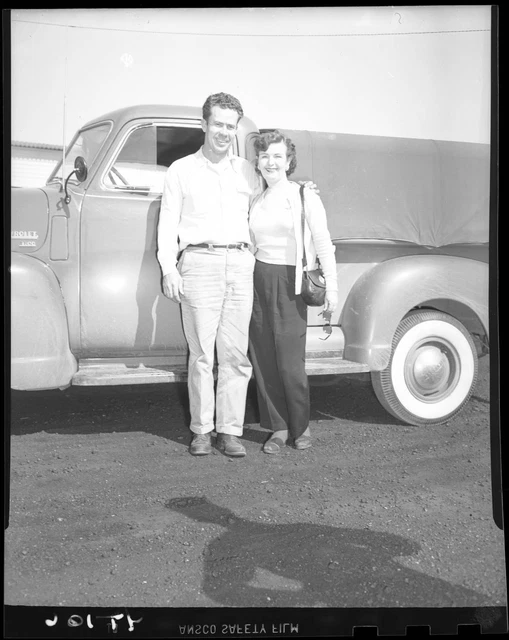 DRIVER HAL COLE and his wife stand together in front of a truck 1949 ...