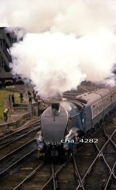 ORIGINAL RAILWAY TRAIN NEGATIVES. LNER A4 Class loco No. 4498 leaving ...