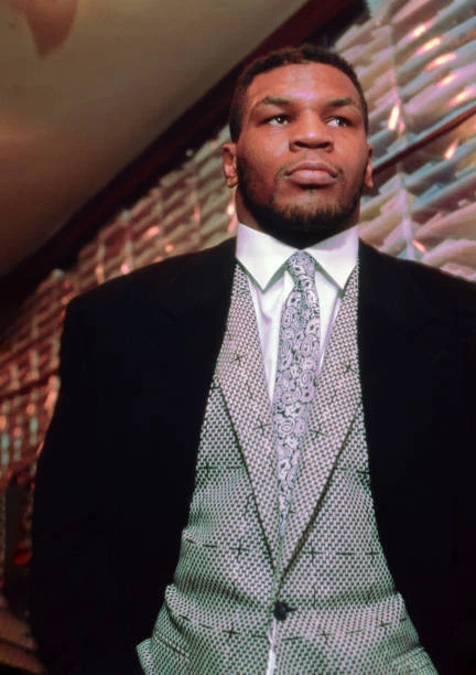 MIKE TYSON POSES for a photo while fitted for a suit during a phot- Old ...
