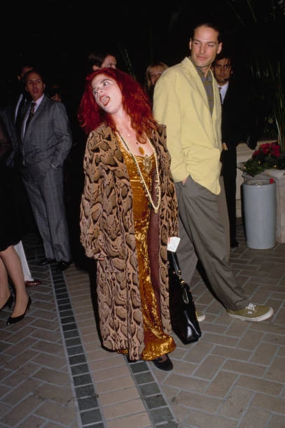 ACTRESS OLIVIA BARASH Wearing A Long Snakeskin-Effect Coat Over An- Old ...