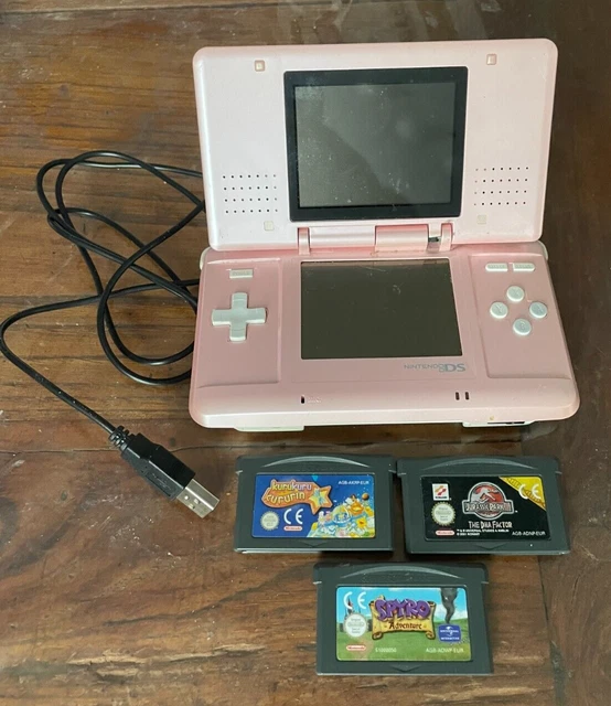 CONSOLE NINTENDO DS Rose avec 3 Jeux Spyro, Jurassic Park III, Kurukuru ...