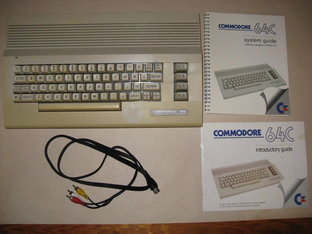 MOSTLY WORKING COMMODORE 64c computer with manuals and reset button ...