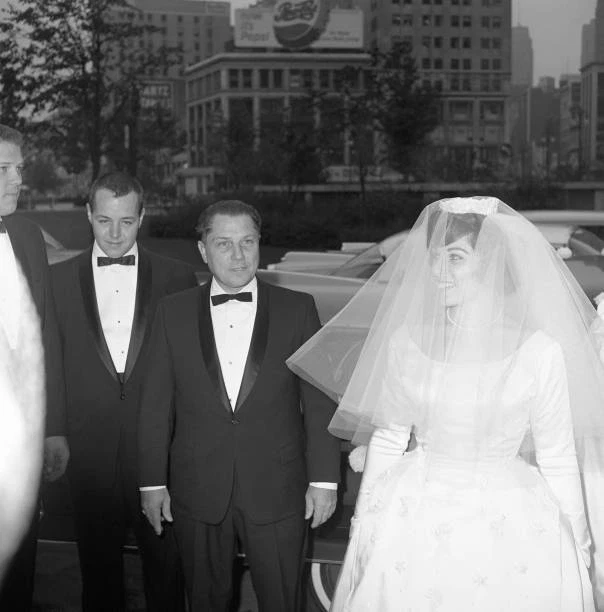 TEAMSTERS PRESIDENT JIMMY Hoffa helps daughter Barbara Ann fro- 1961 ...