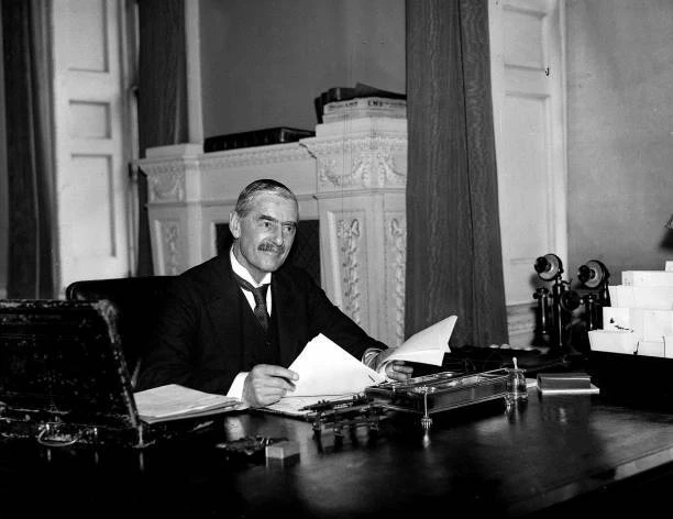 NEVILLE CHAMBERLAIN CHANCELLOR Exchequer preparing budget which is ...